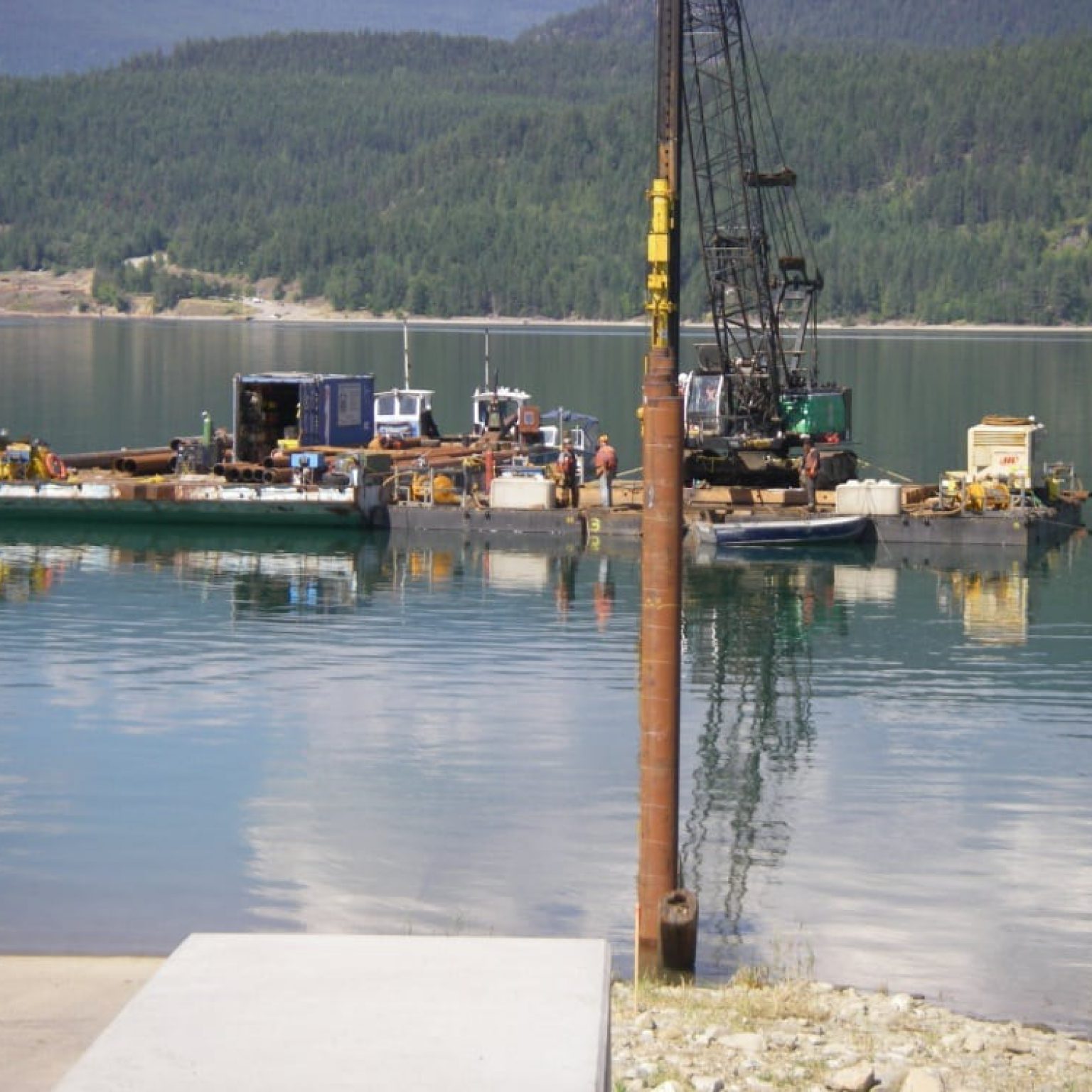 Pile Driving from a Barge - Johnston Construction