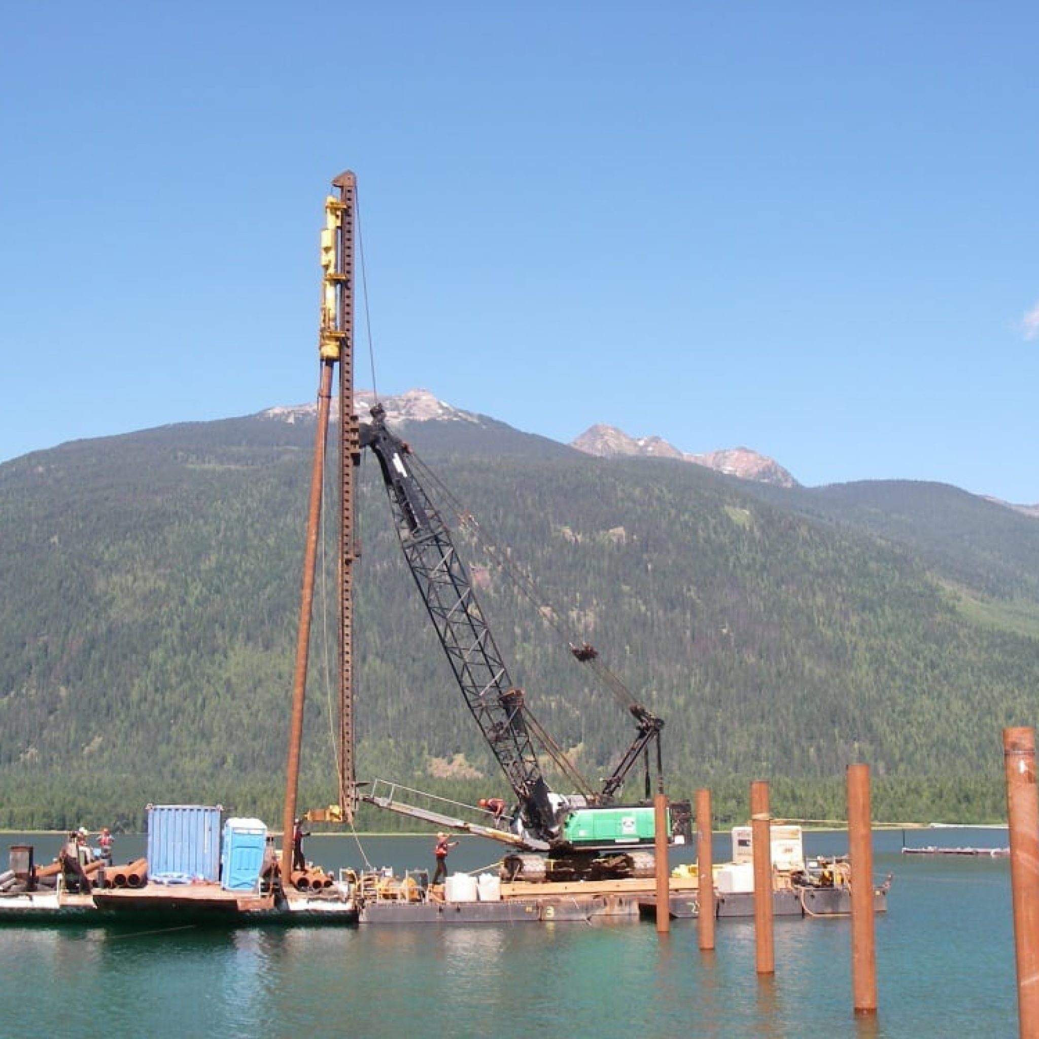 Pile Driving from a Barge - Johnston Construction